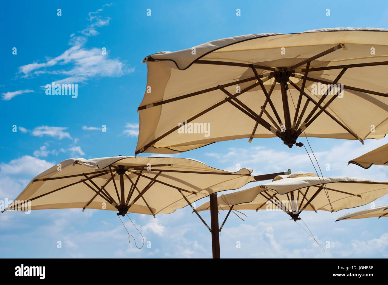 Parasols blue sky shadow hi-res stock photography and images - Alamy