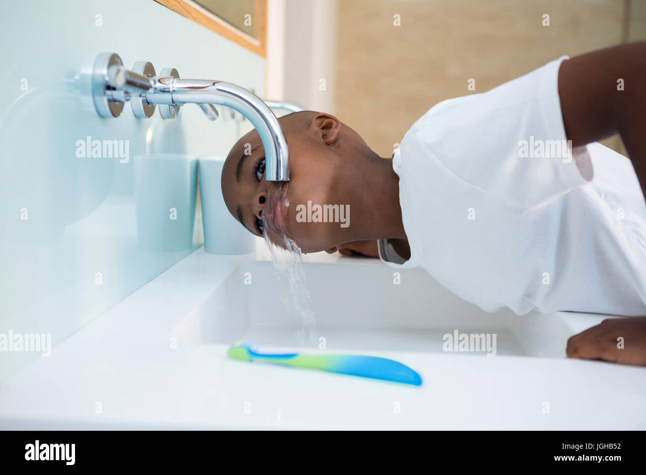 Child brushing teeth sink water hi-res stock photography and images - Alamy
