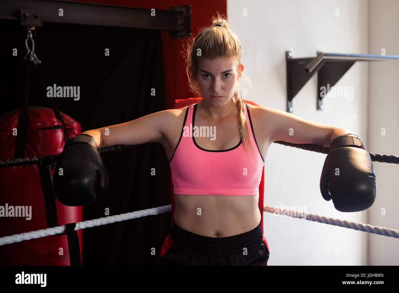 Woman sitting in boxing ring hi-res stock photography and images - Alamy