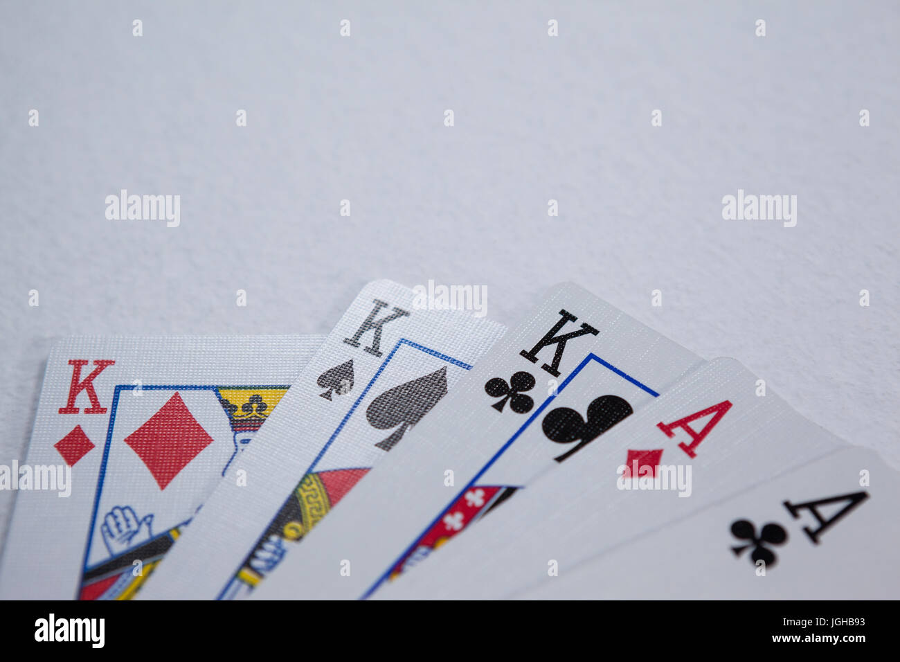 Close-up of playing cards arranged on white background Stock Photo - Alamy