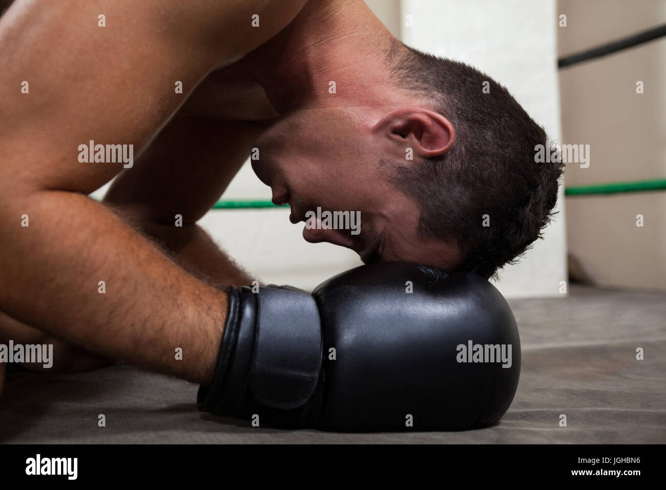 Young boxer relaxing in the boxing ring Stock Photo - Alamy