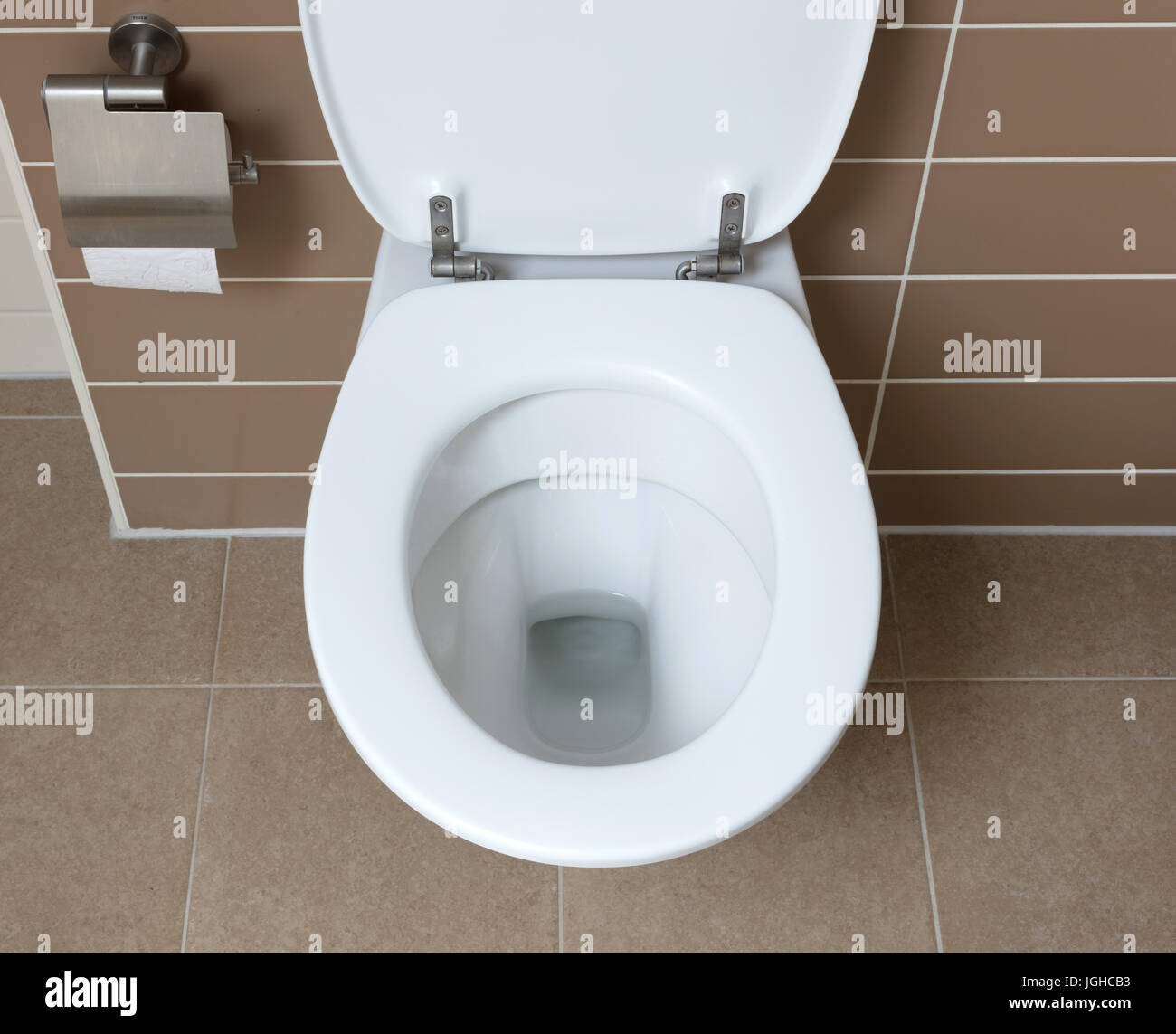 Modern white toilet bowl in the bathroom Stock Photo - Alamy