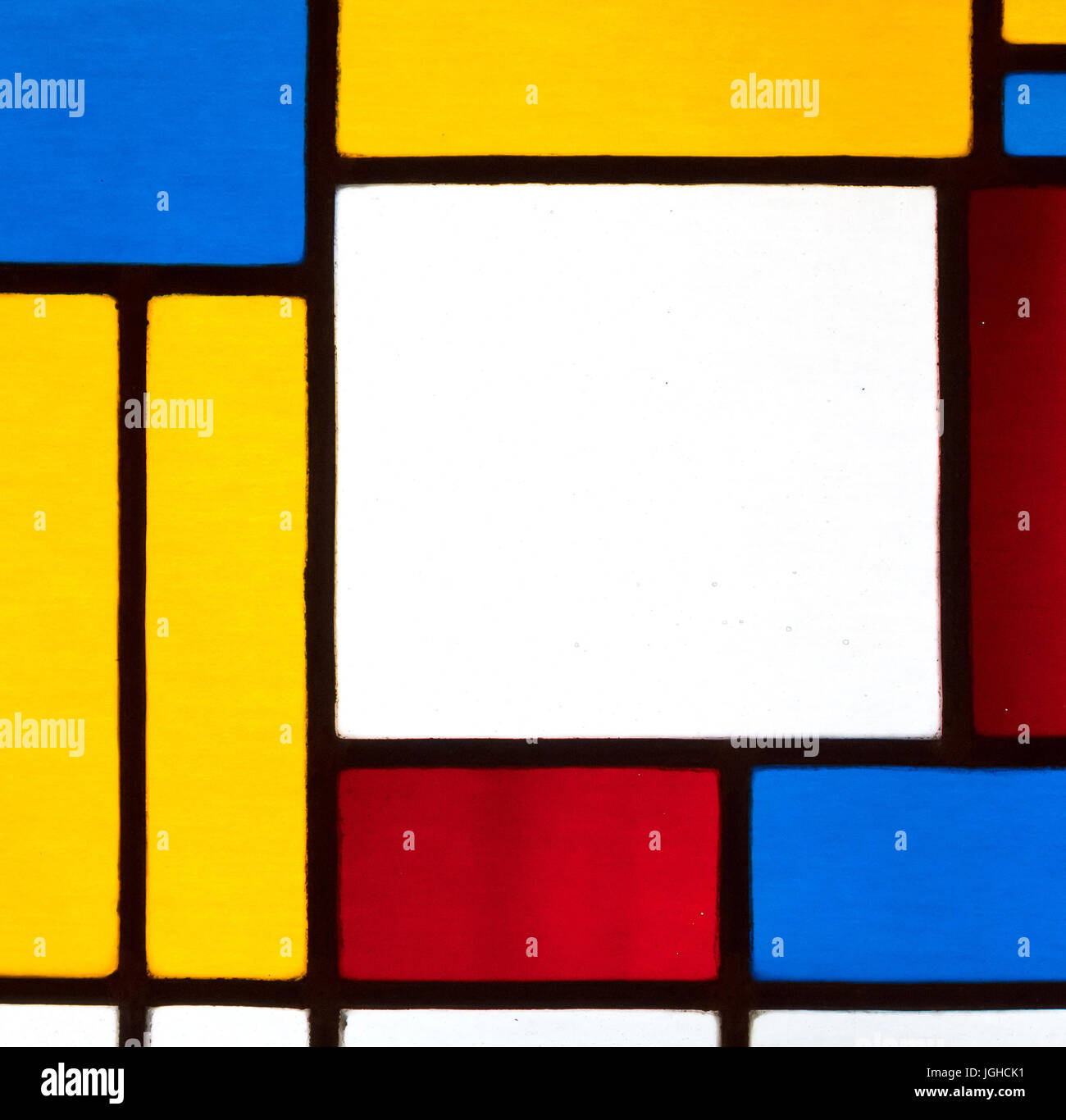 Image of a multicolored stained glass window with irregular block ...