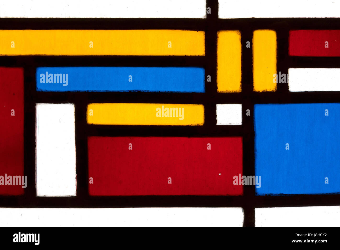 Image of a multicolored stained glass window with irregular block ...