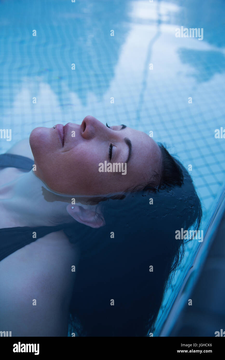 Woman sleeping pool hi-res stock photography and images - Alamy