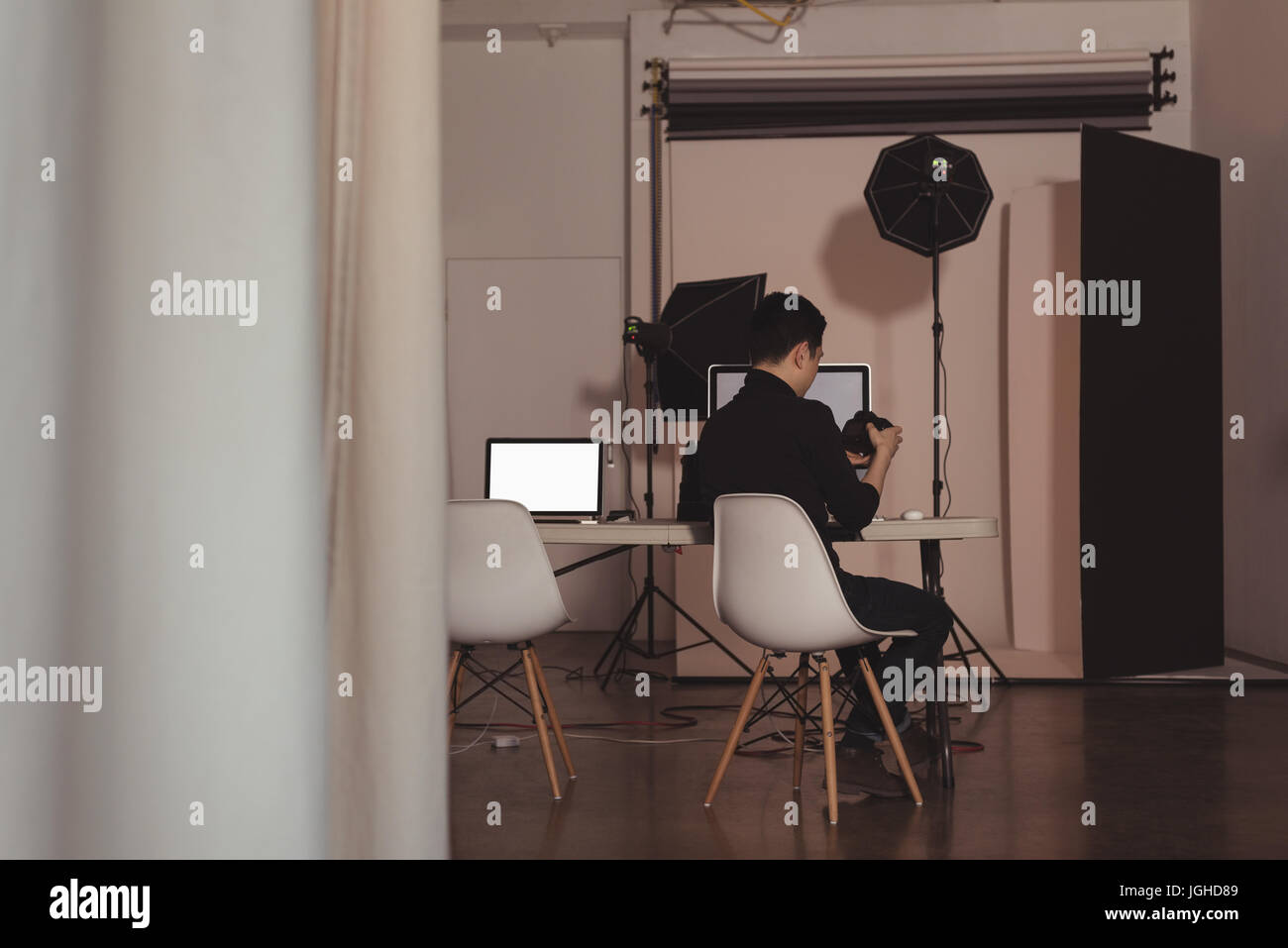 Sitting holding technology expertise hi-res stock photography and ...