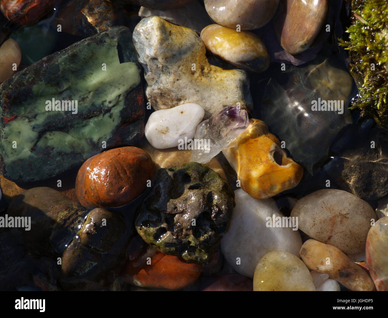 rocks and pebbles in water Stock Photo - Alamy