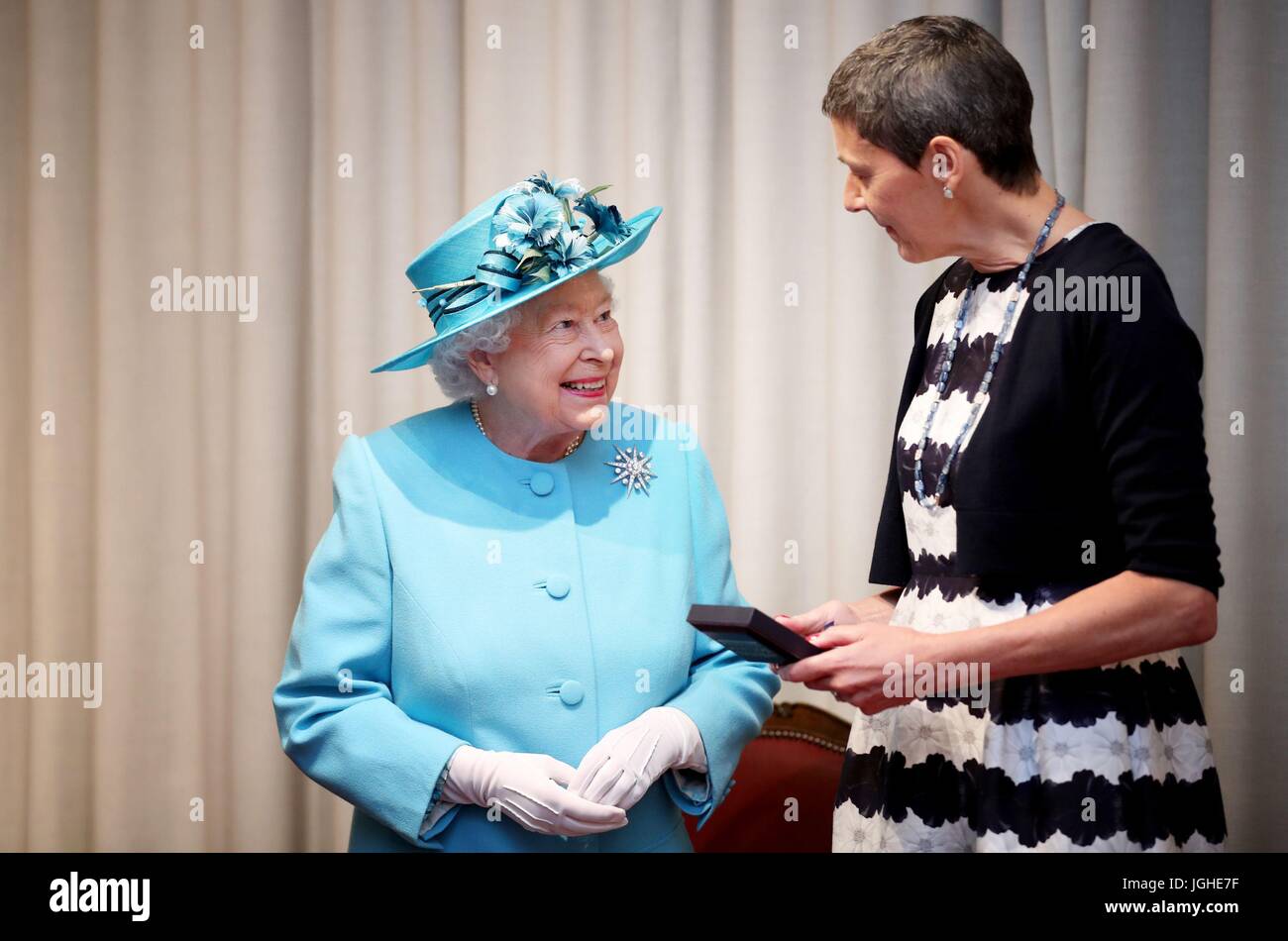 Queen Elizabeth II presents the Royal Medal to Professor Tessa Holyoake ...