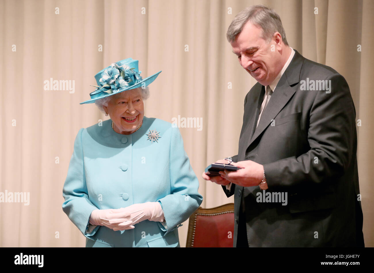 Queen Elizabeth II presents the Royal Medal to Professor Peter Boyle ...