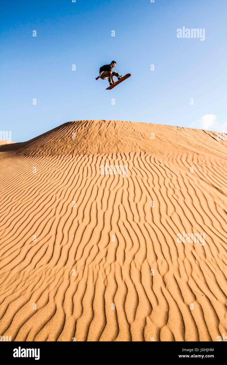 Sandboarding in Cerro Dragon, in Atacama Desert. Iquique, Tarapaca ...