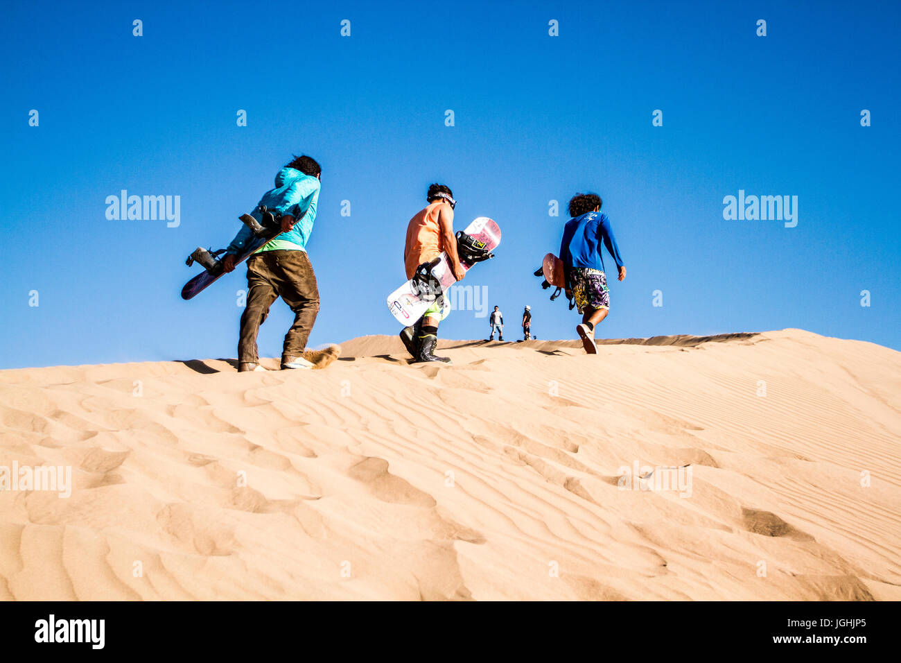 Sandboarding on Atacama Desert. Iquique, Tarapaca Region, Chile. 15.11. ...