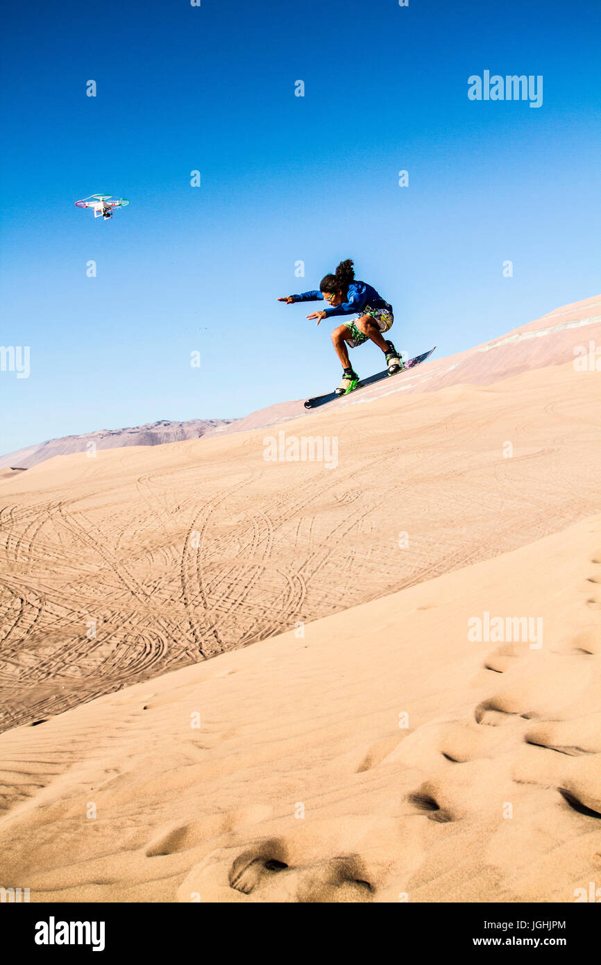 Sandboarding on Atacama Desert. Iquique, Tarapaca Region, Chile. 15.11. ...