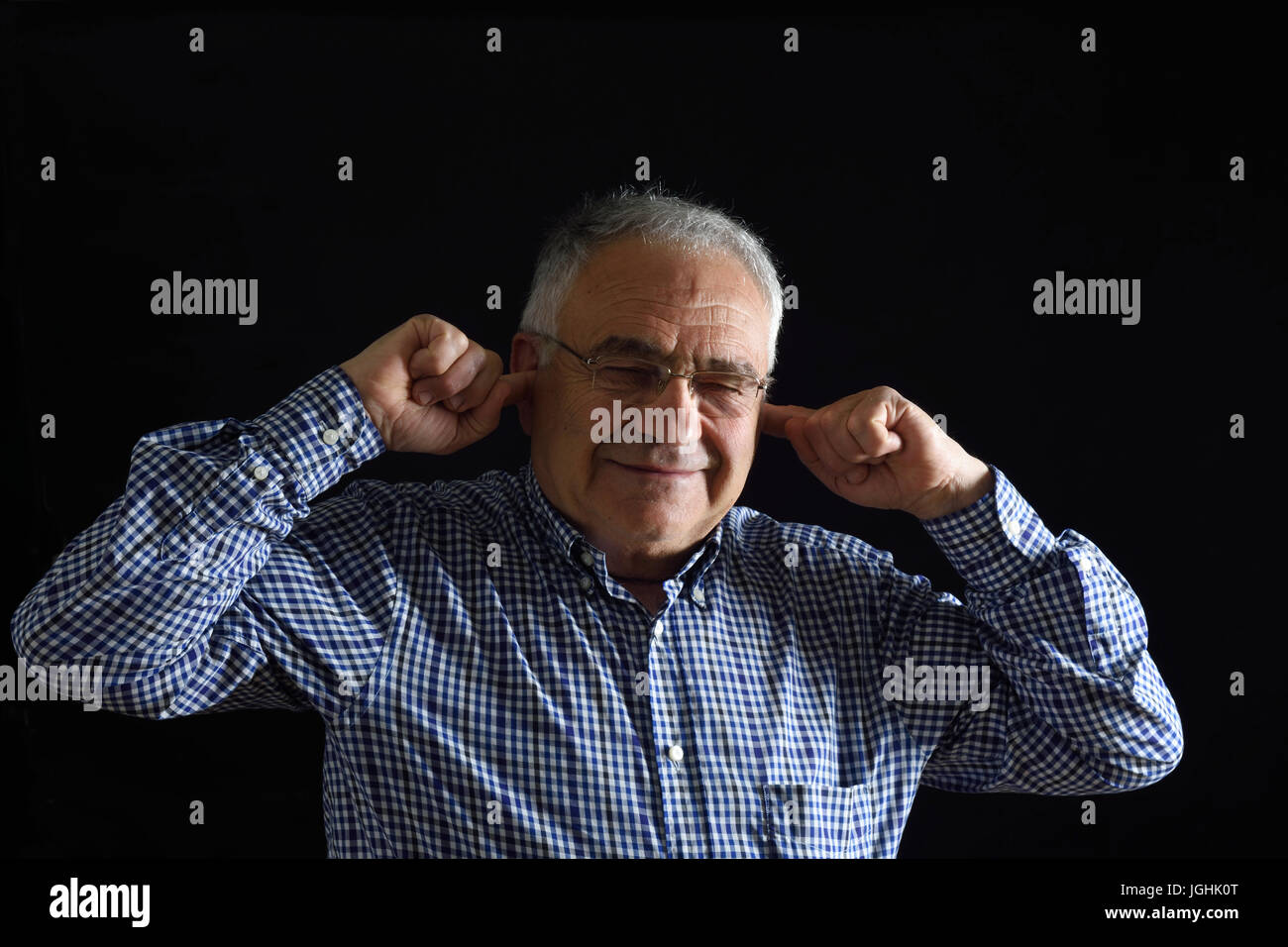 portrait of retired man with noisy on black Stock Photo - Alamy