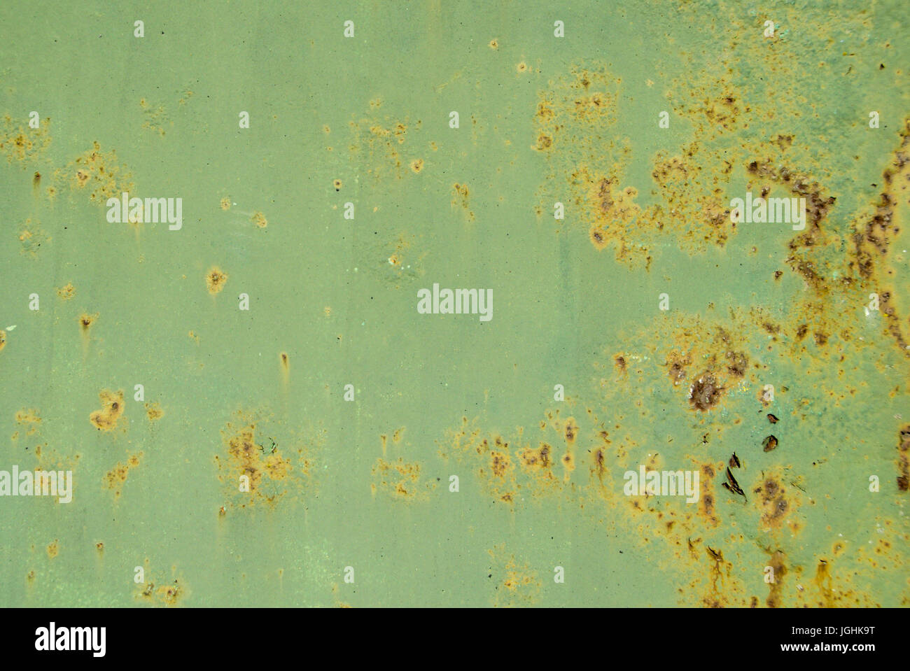 Specks of rust on old green painted metal Stock Photo - Alamy