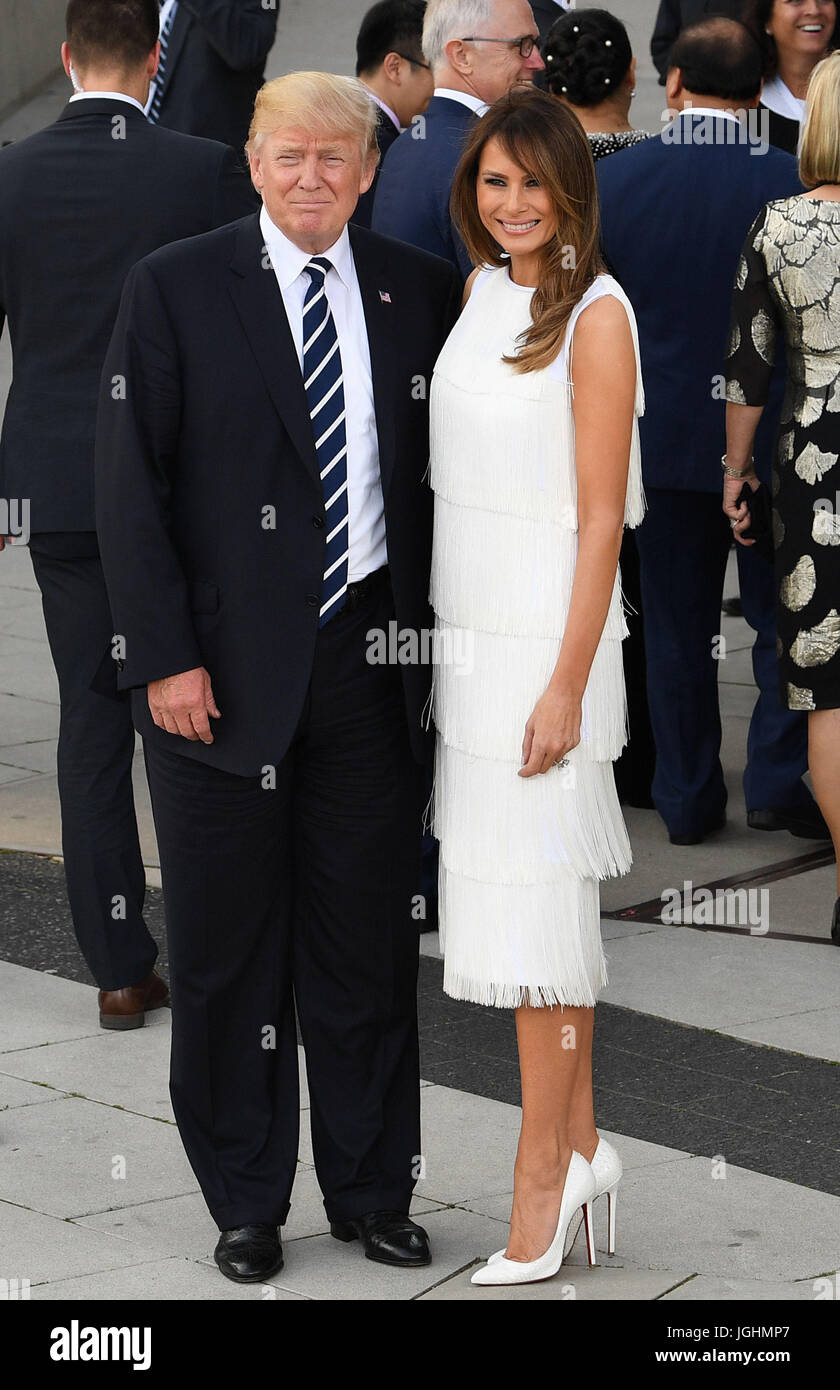 US President Donald Trump and his wife Melania arrive to attend a ...