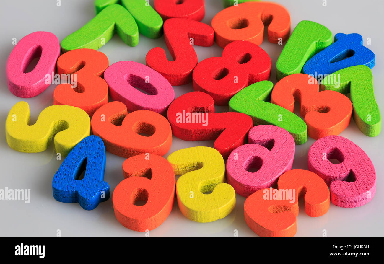 Colored wooden made numbers Stock Photo - Alamy