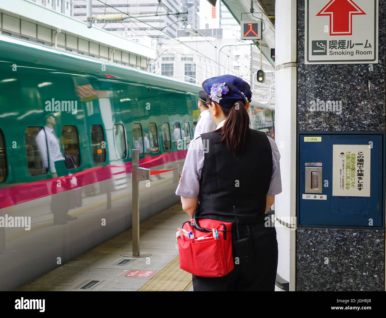 Tokyo, Japan - May 15, 2017. Railway staff waiting at the JR Shinkansen ...