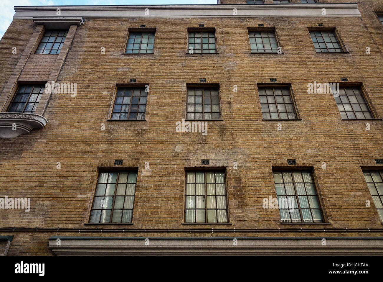 Old brick building with many glass windows in Tokyo, Japan Stock Photo ...
