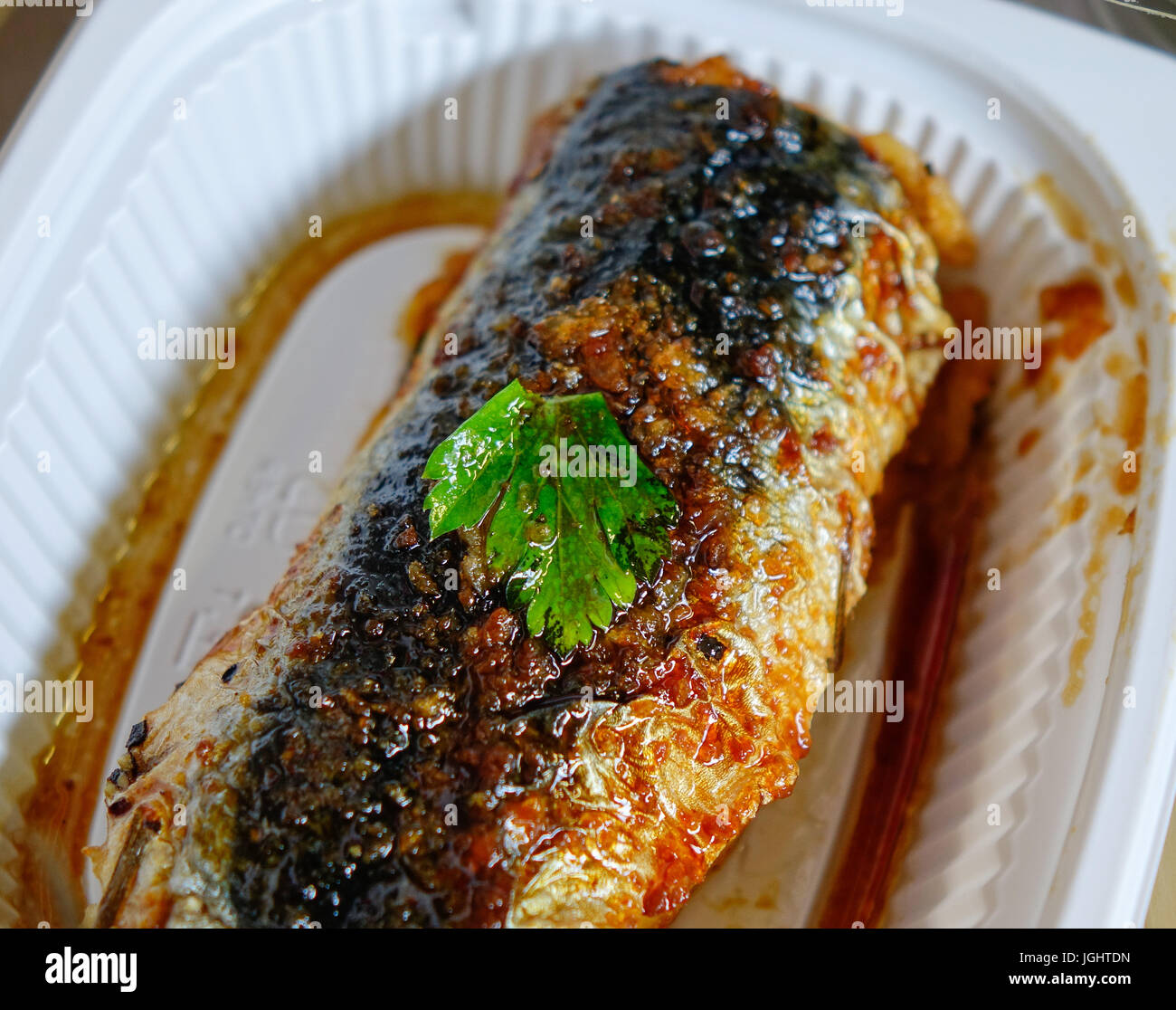 Japanese fish with sauce for lunch in the box. Close up Stock Photo - Alamy