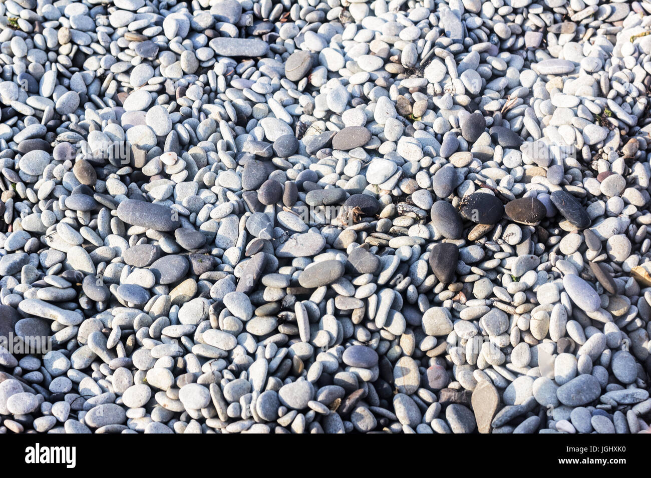 Relax grey sea pebbles on beach at day Stock Photo - Alamy