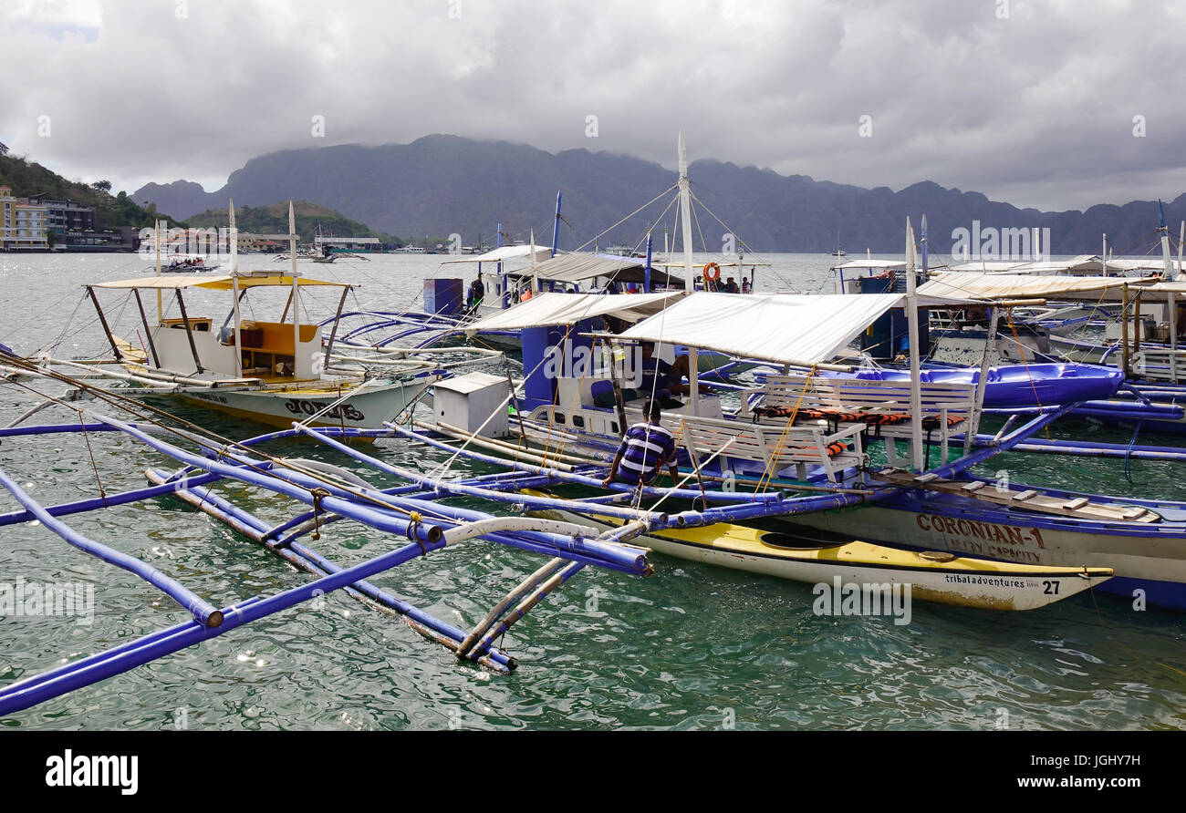 Coron, Philippines - Apr 9, 2017. Wooden boats docking at the tourist ...