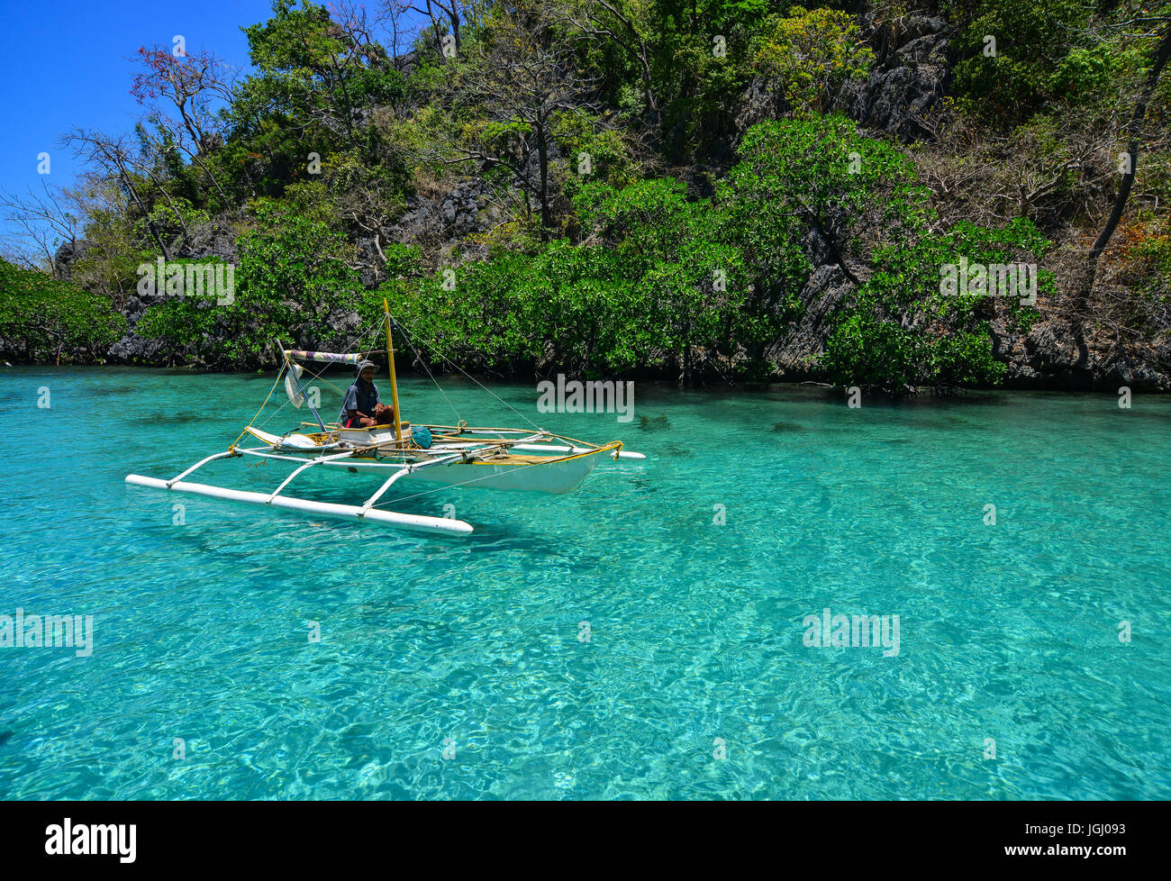 Palawan, Philippines - Apr 11, 2017. A man on the wooden boat in ...