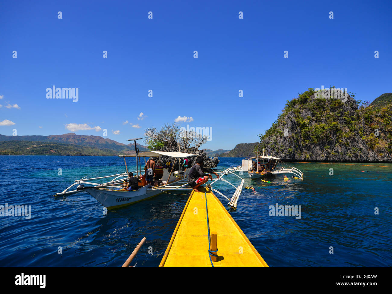 Palawan, Philippines - Apr 11, 2017. Tourist boats docking on the blue ...