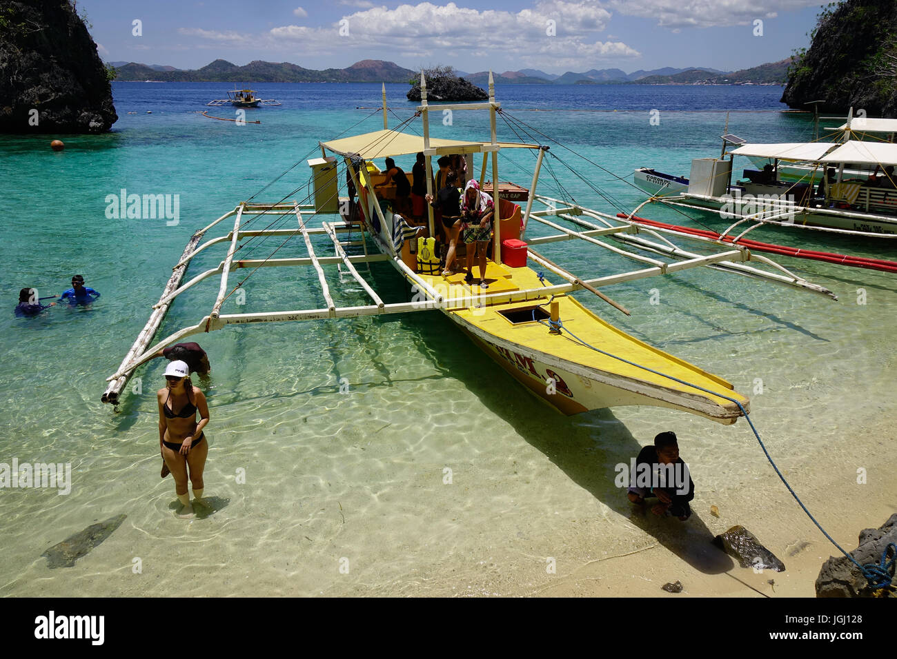 Palawan, Philippines - Apr 11, 2017. People and wooden boats on Palawan ...