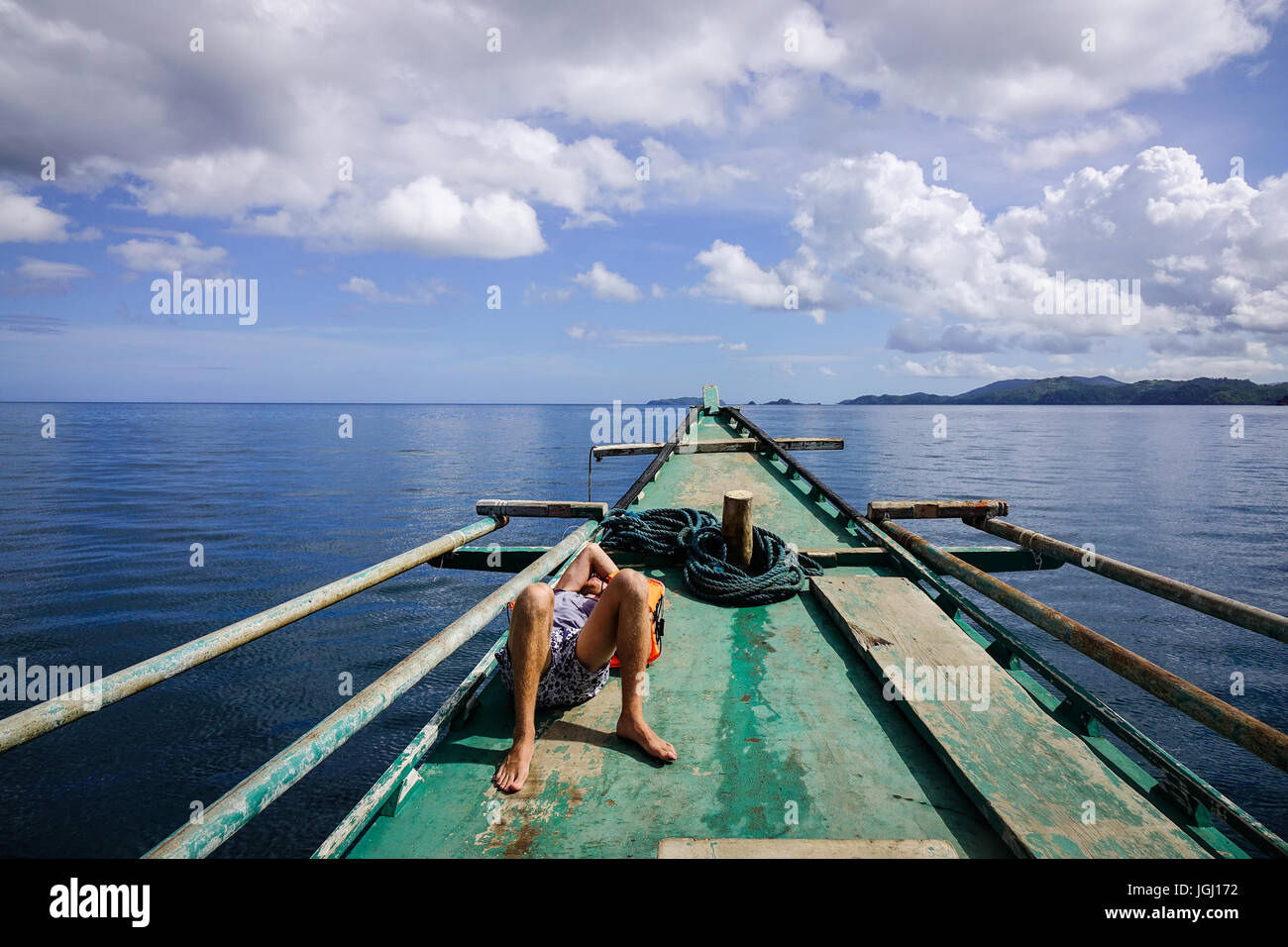 Coron, Philippines - Apr 8, 2017. A man on wooden boat in Coron Island ...