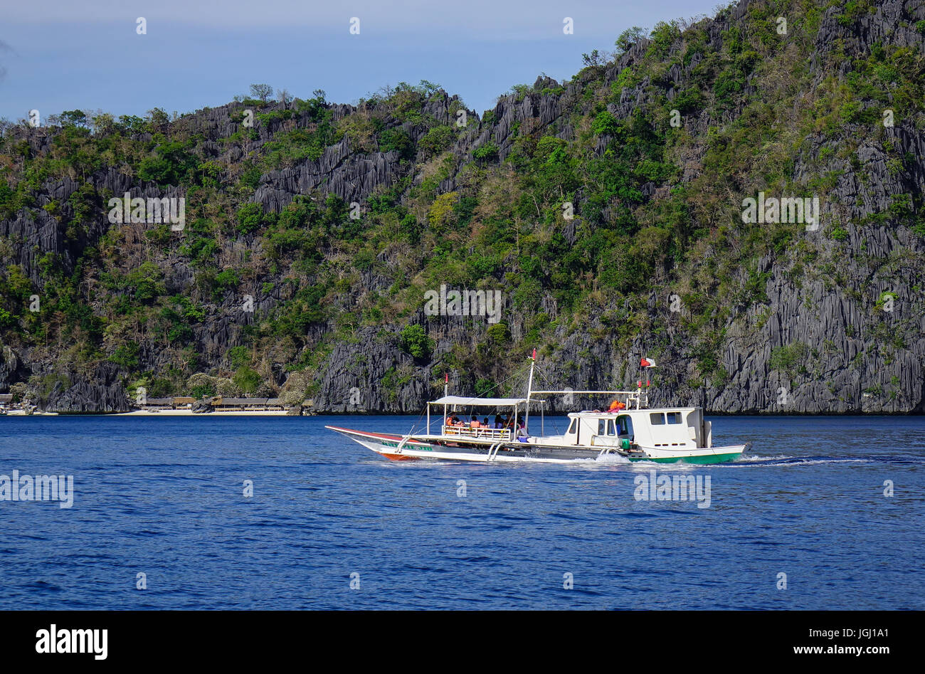 Coron, Philippines - Apr 8, 2017. A ship running on blue sea in Coron ...