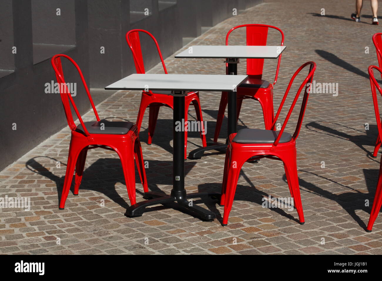 Row chairs one red hi-res stock photography and images - Alamy
