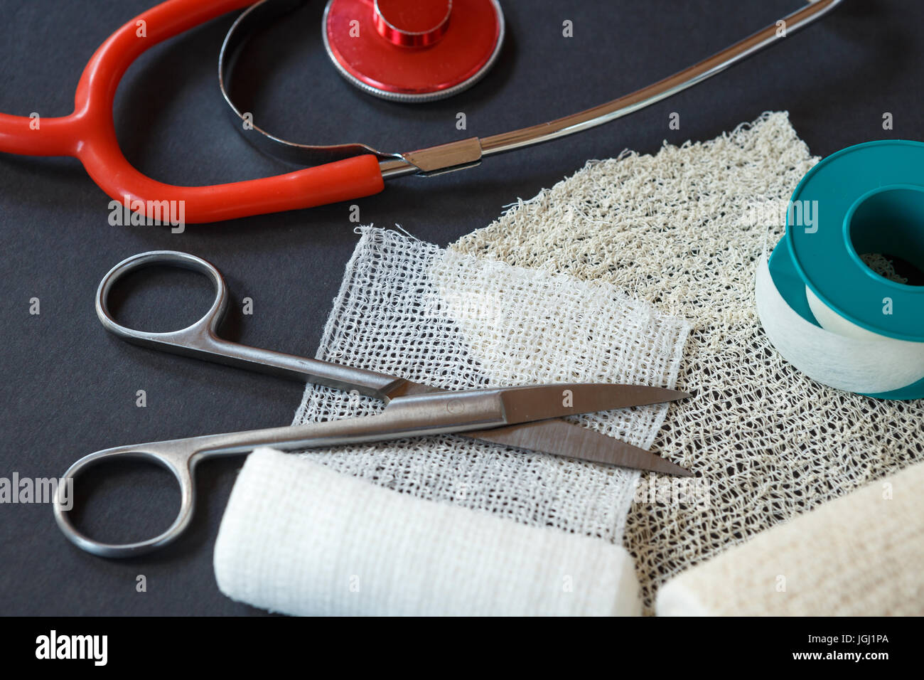 Medical bandages with scissors, sticking plaster and medical ...