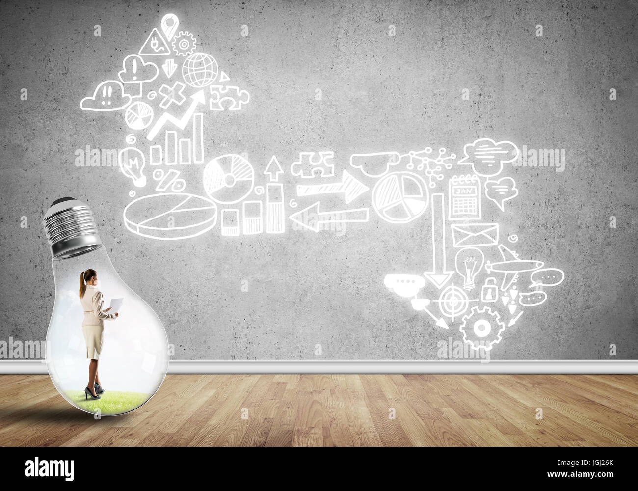 Businesswoman trapped in bulb Stock Photo - Alamy