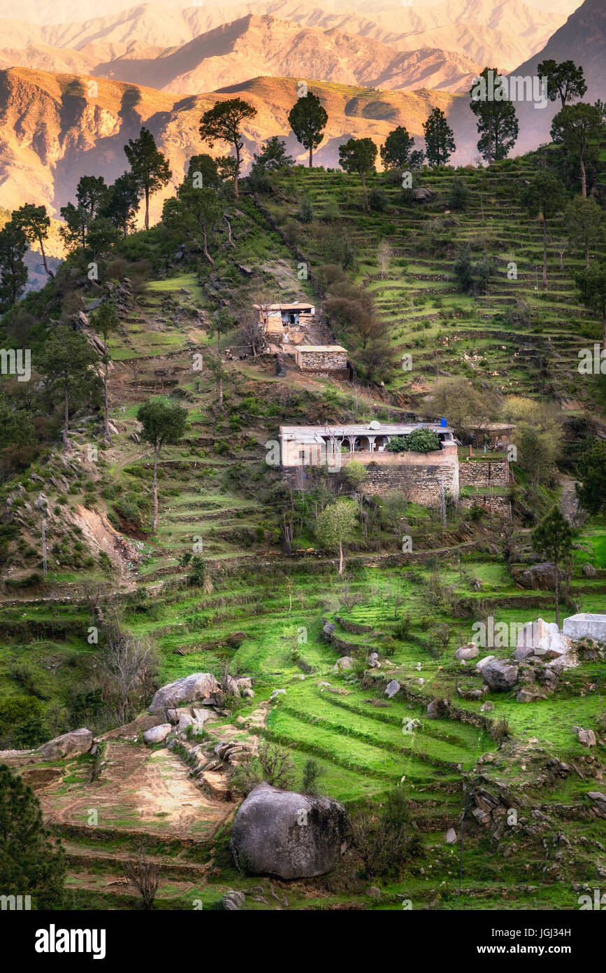 Village with traditional stone houses scattered on the mountain side in ...
