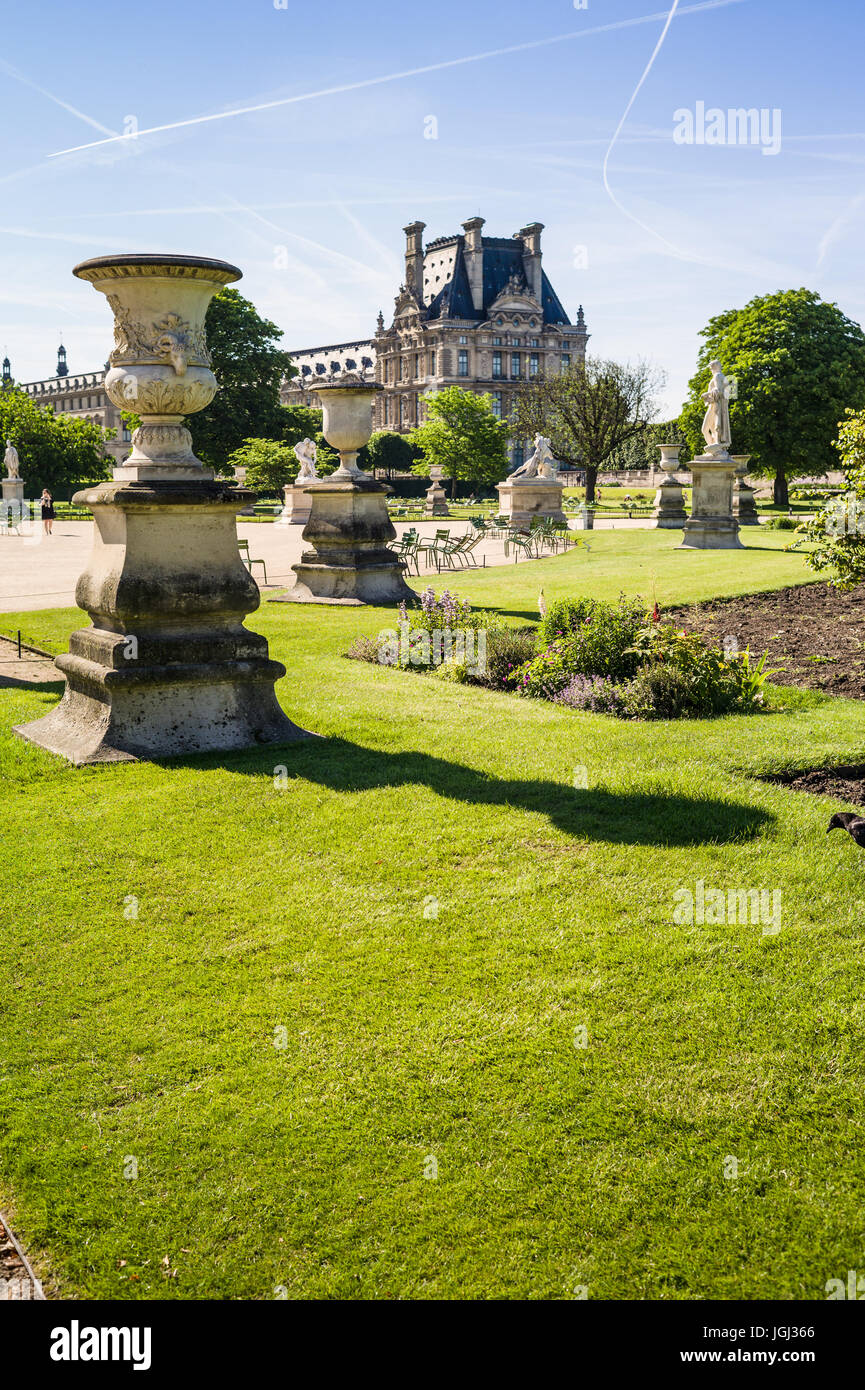 The Tuileries garden in Paris, France, by a sunny morning with a carved ...