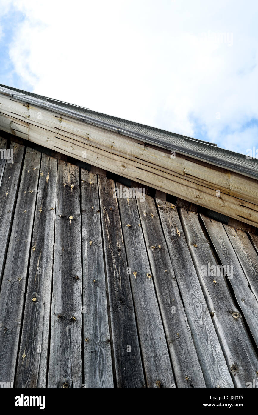 Closeup details of an old log timber home with aged and textured wood ...