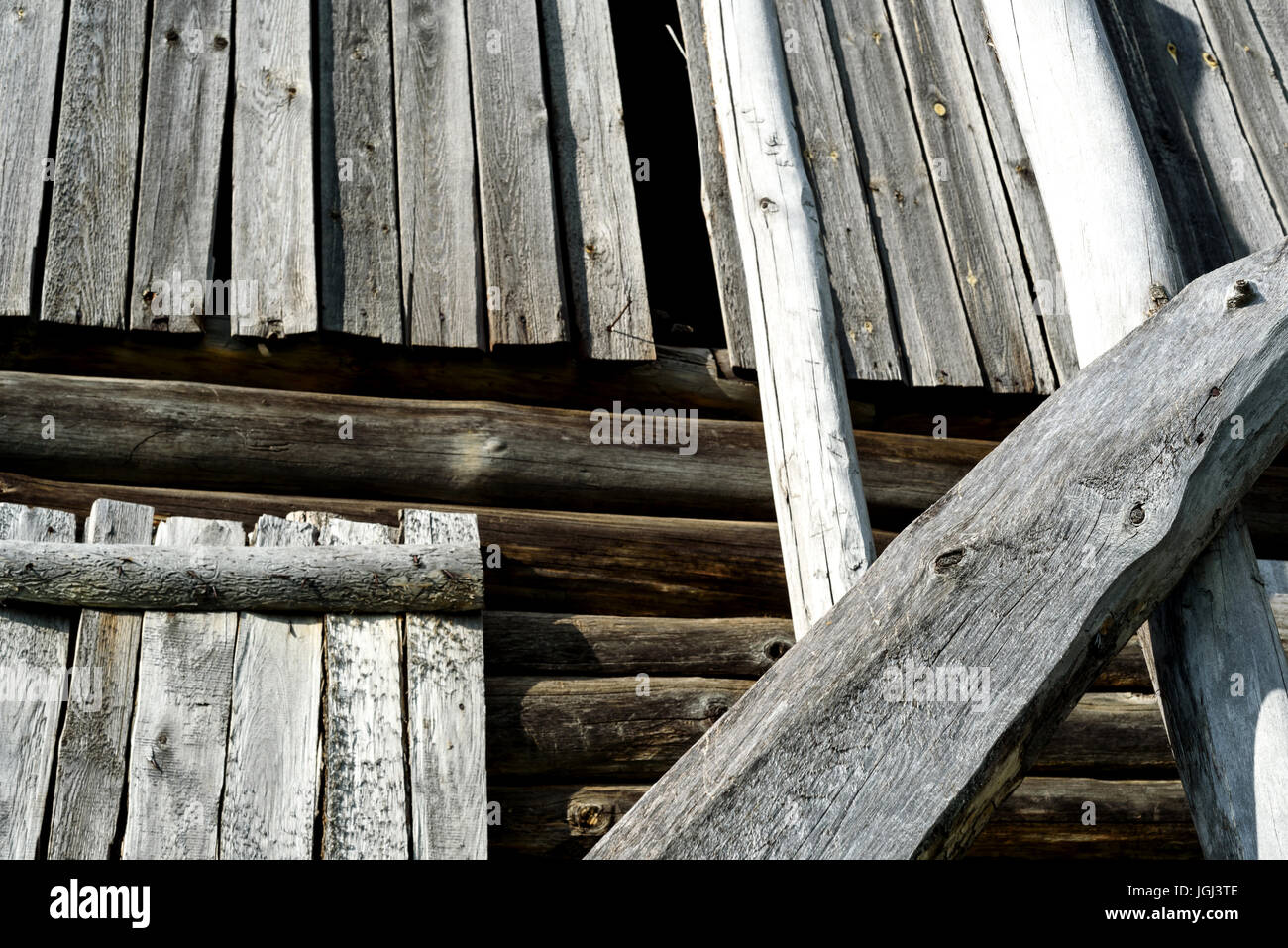 Closeup details of an old log timber home with aged and textured wood ...
