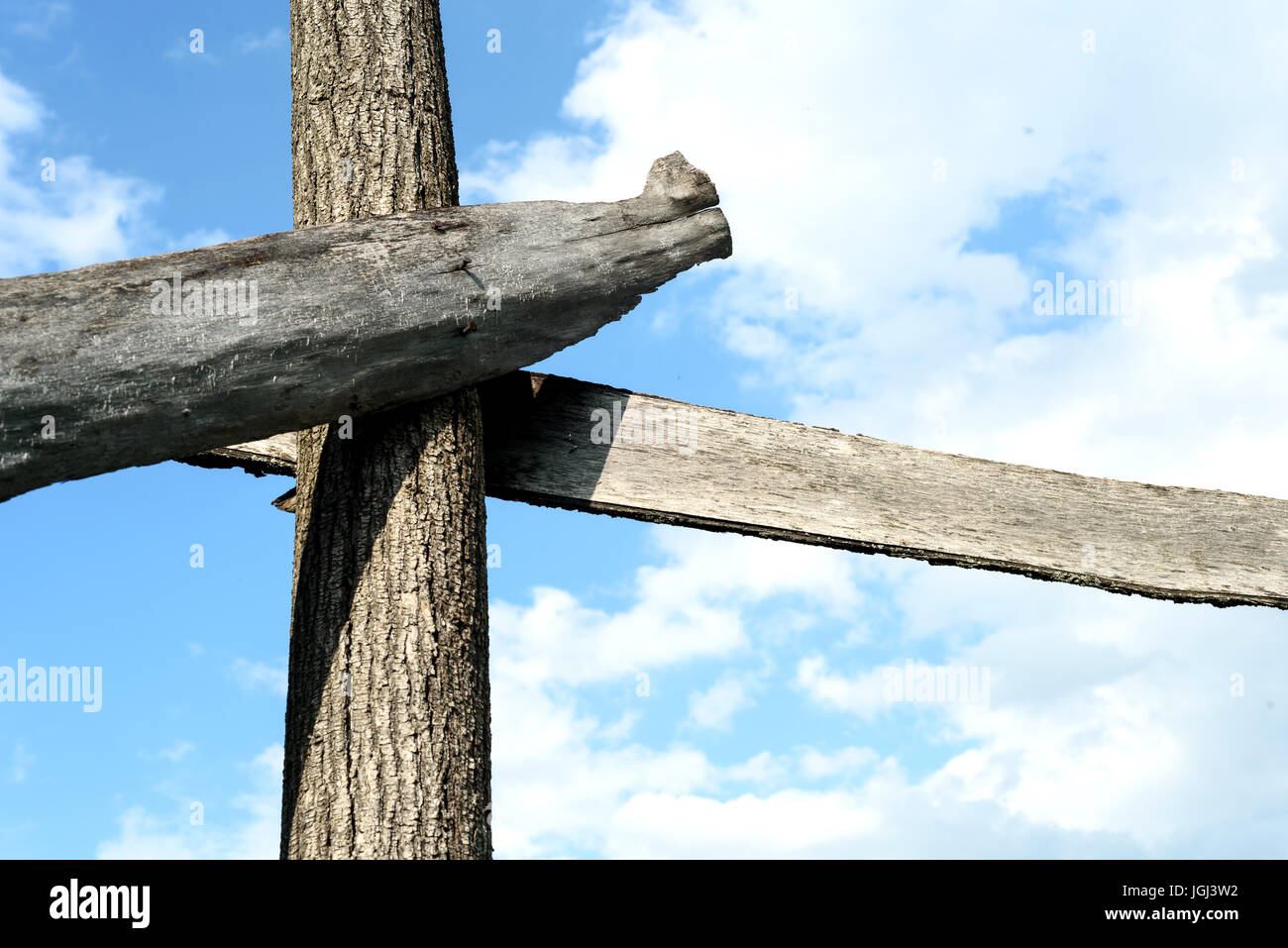 Old wooden timber logs joined together with blue sky Stock Photo - Alamy