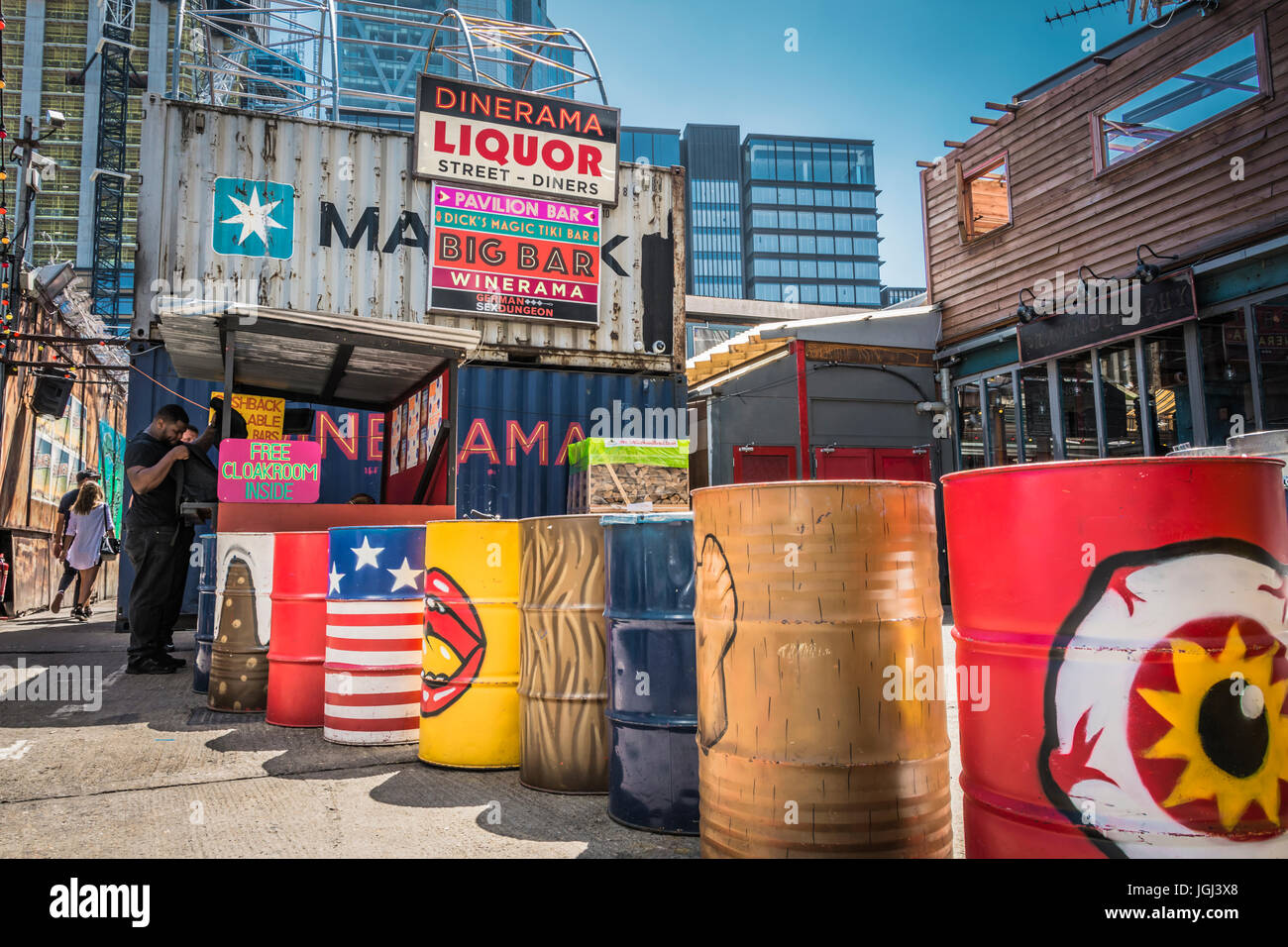 Oil barrel strewn colourful entrance to the Dinerama and Big Bar in ...