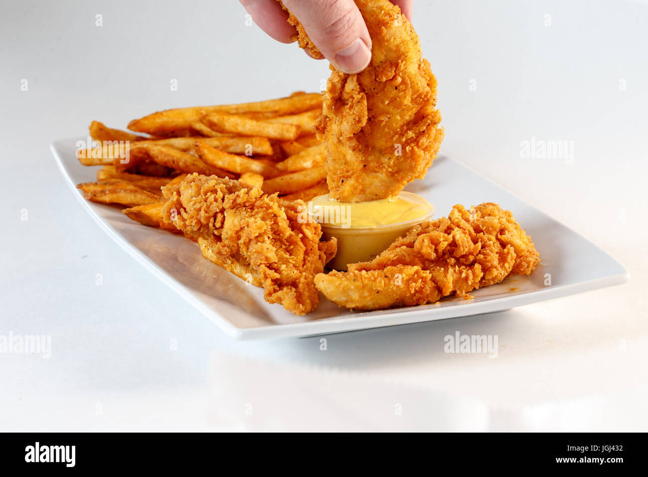 fried chicken fingers/nuggets w/ chips Stock Photo - Alamy