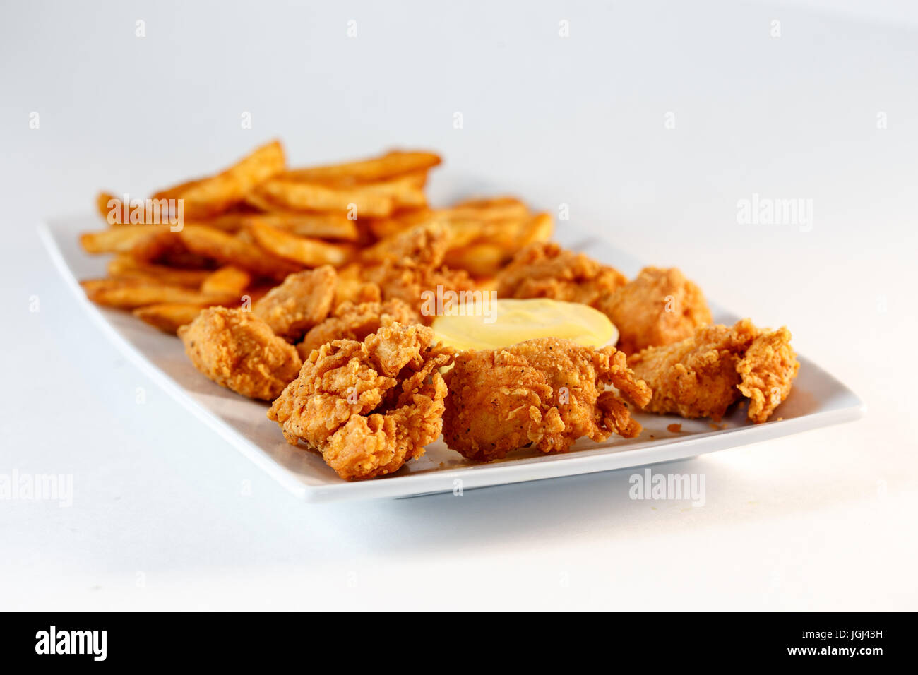 fried chicken fingers/nuggets w/ chips Stock Photo - Alamy