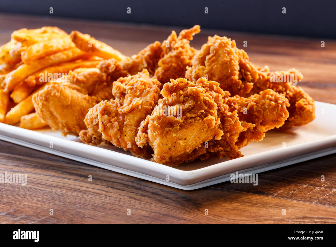 fried chicken fingers/nuggets w/ chips Stock Photo - Alamy