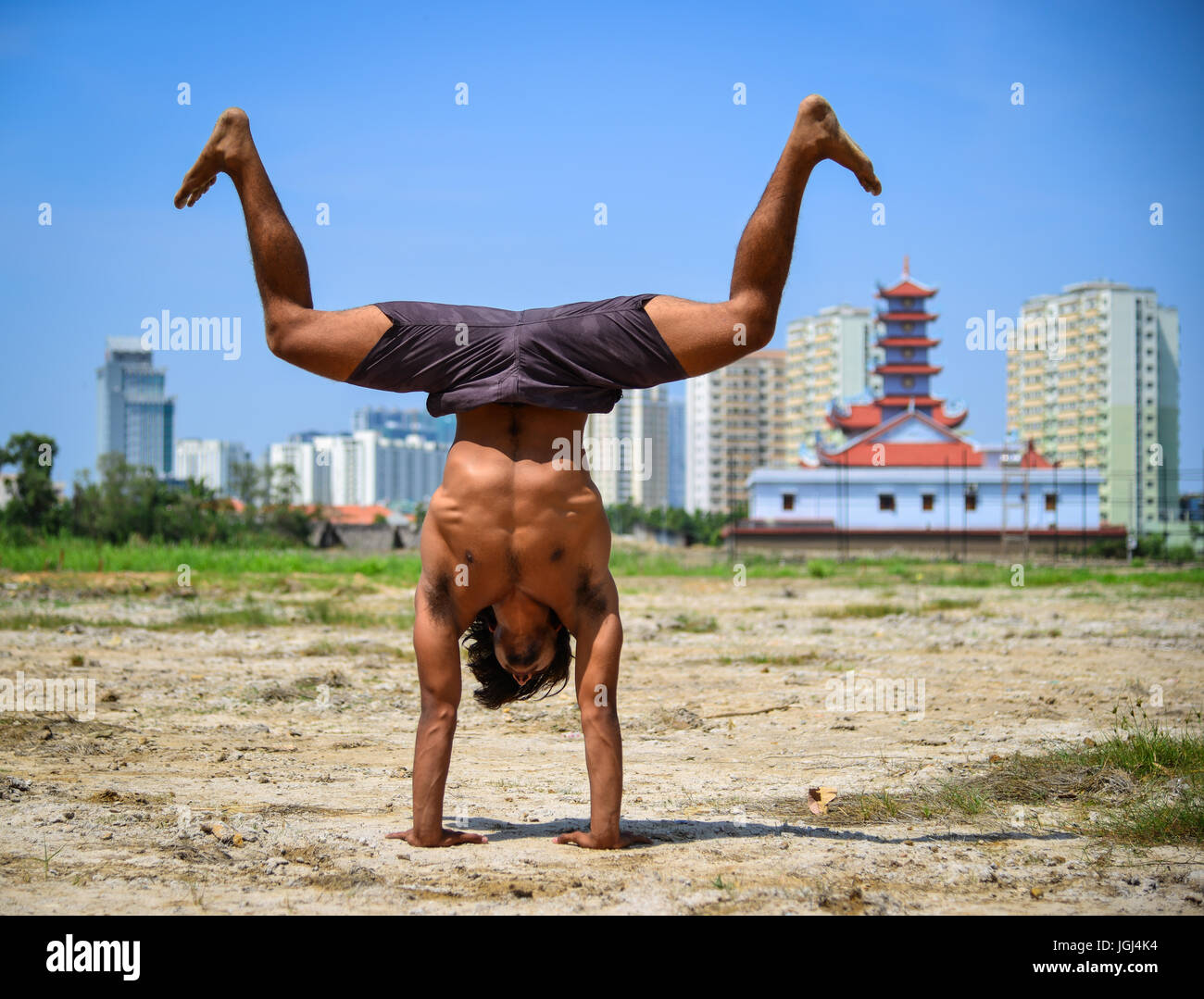 Young Indian man doing yoga exercise at sunny day in the park Stock ...