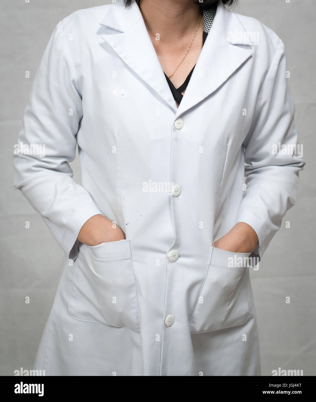 Asian doctor (female) in white uniform. Half body Stock Photo - Alamy