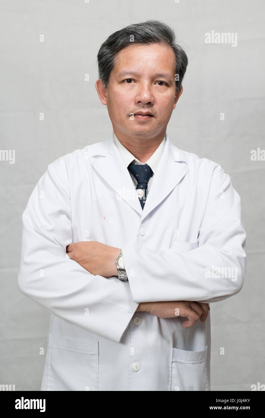 Portrait of an Asian doctor in uniform at the studio. Close up Stock ...