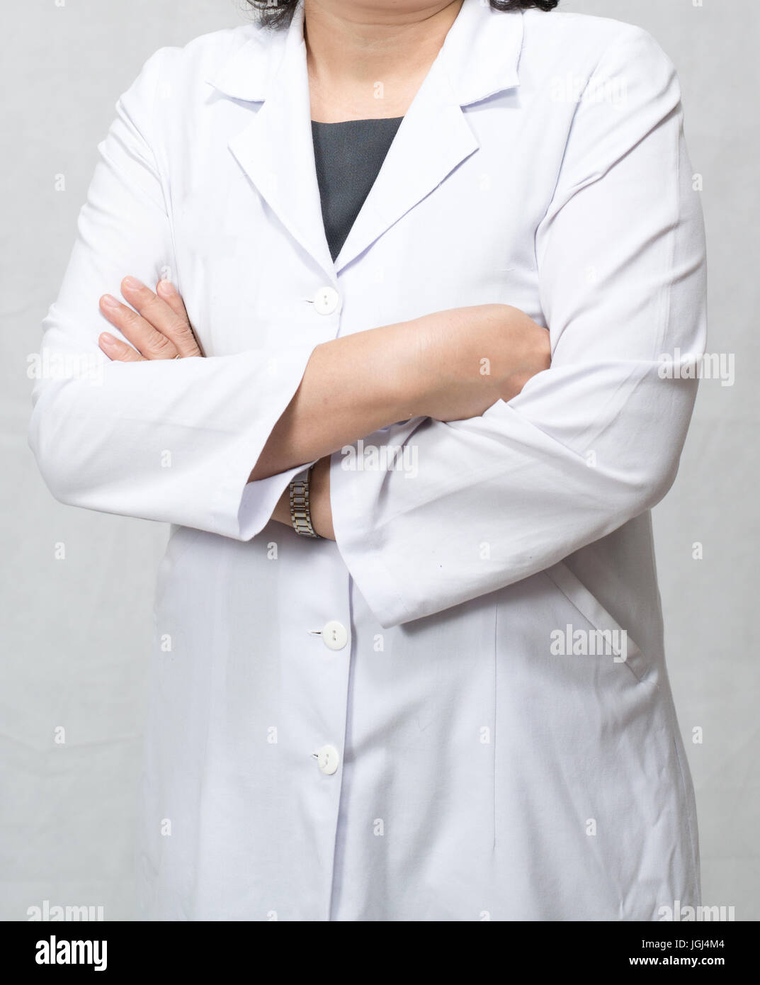 Young Asian doctor in uniform. Half body. At studio Stock Photo - Alamy