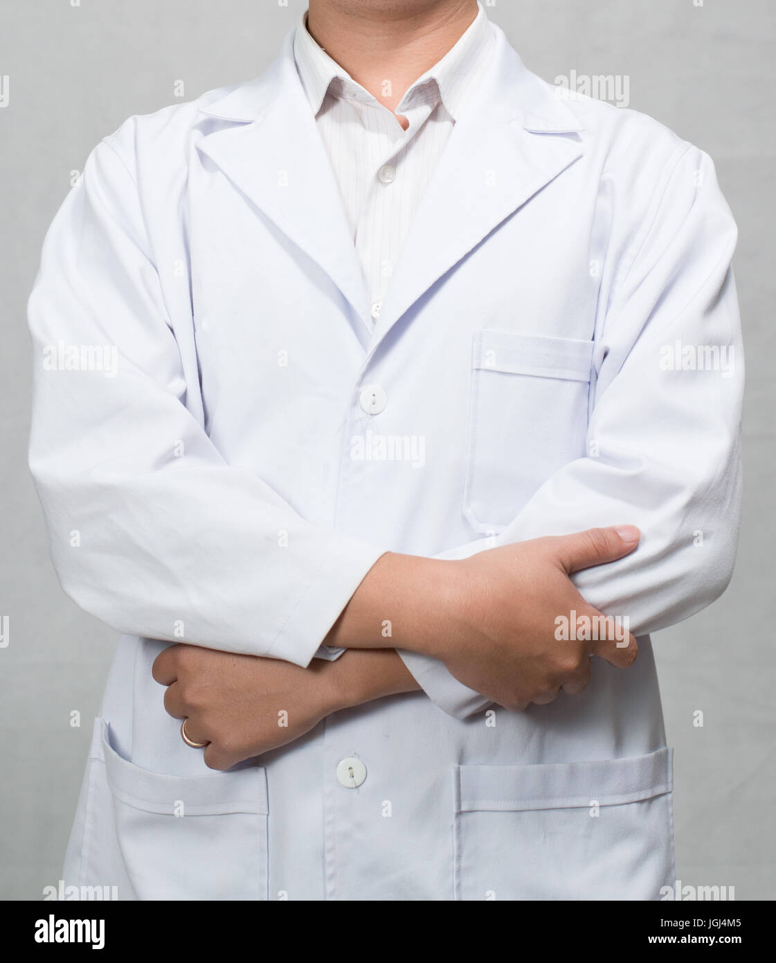 A young man doctor in the uniform. Half body. Close up Stock Photo - Alamy
