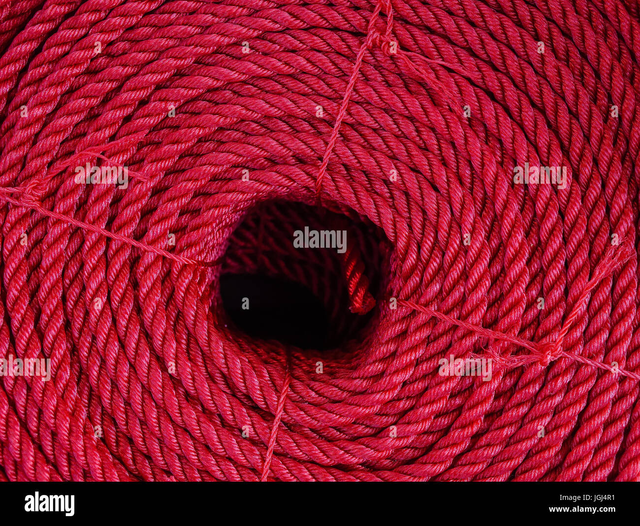 Red rope in piles at the market in Hong Kong. Close up Stock Photo - Alamy