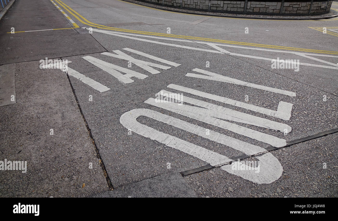 Taxi lane with sign words at downtown. Close up Stock Photo - Alamy