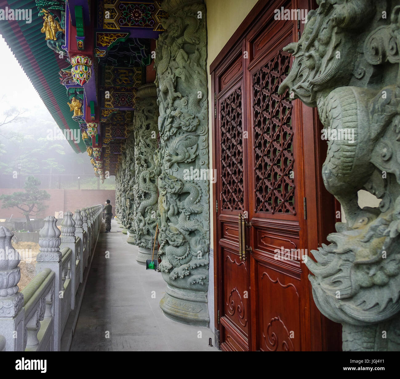Decorations of Po Lin Monastery at rainy day in Hong Kong. Po Lin is an ...